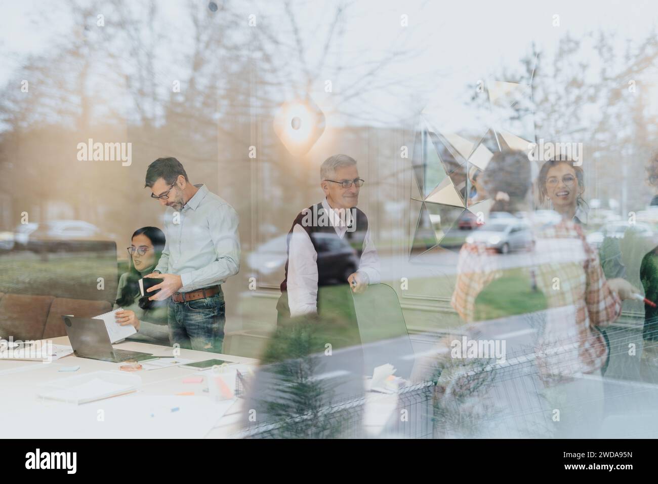 Successful international colleagues brainstorming and sharing ideas for ...