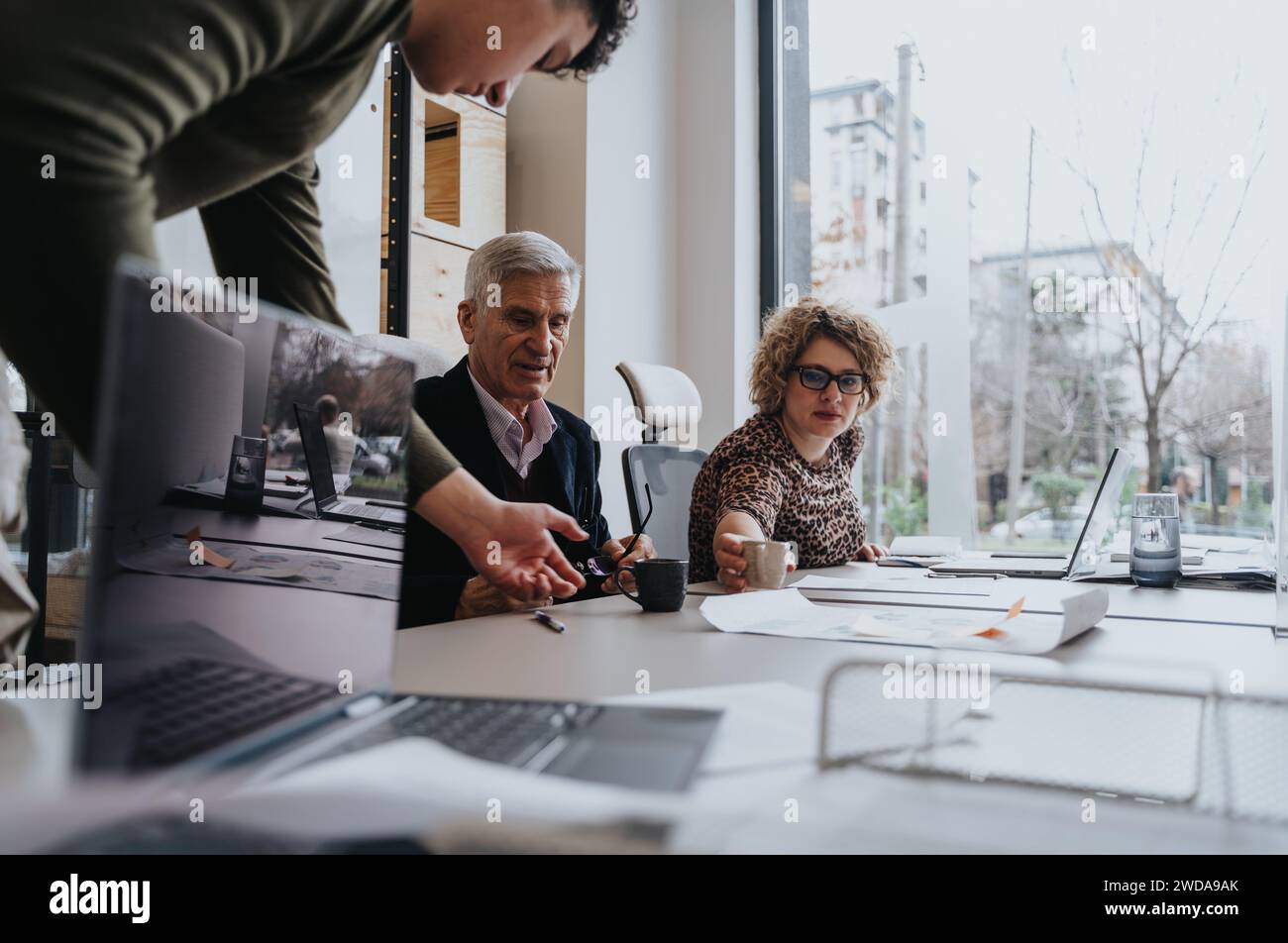 Successful teamwork in an innovative workplace between different aged ...