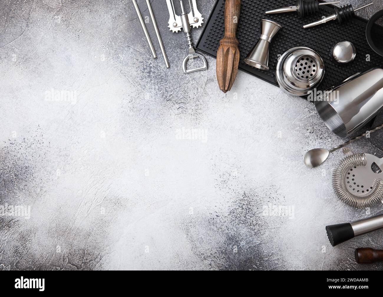 Various bar utensils.Jigger,straw and spoon with black shaker,muddler ...