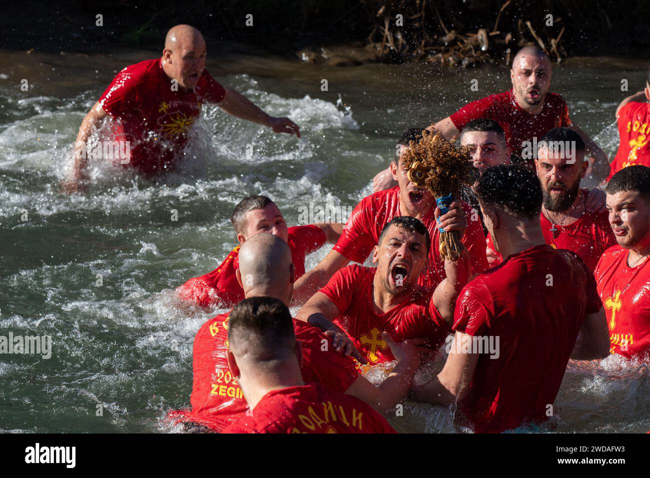 Young boys in the sacred water. Part of orthodox tradition. Epiphany ...