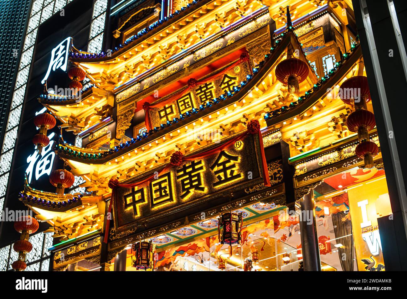 A vibrant nighttime cityscape showcasing a illuminated Asian building ...
