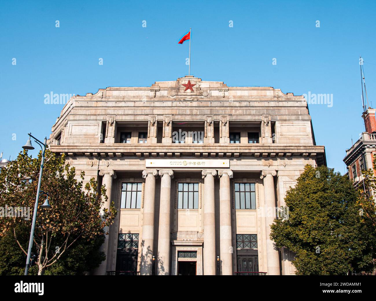 A group of individuals are gathered in front of a majestic stone ...