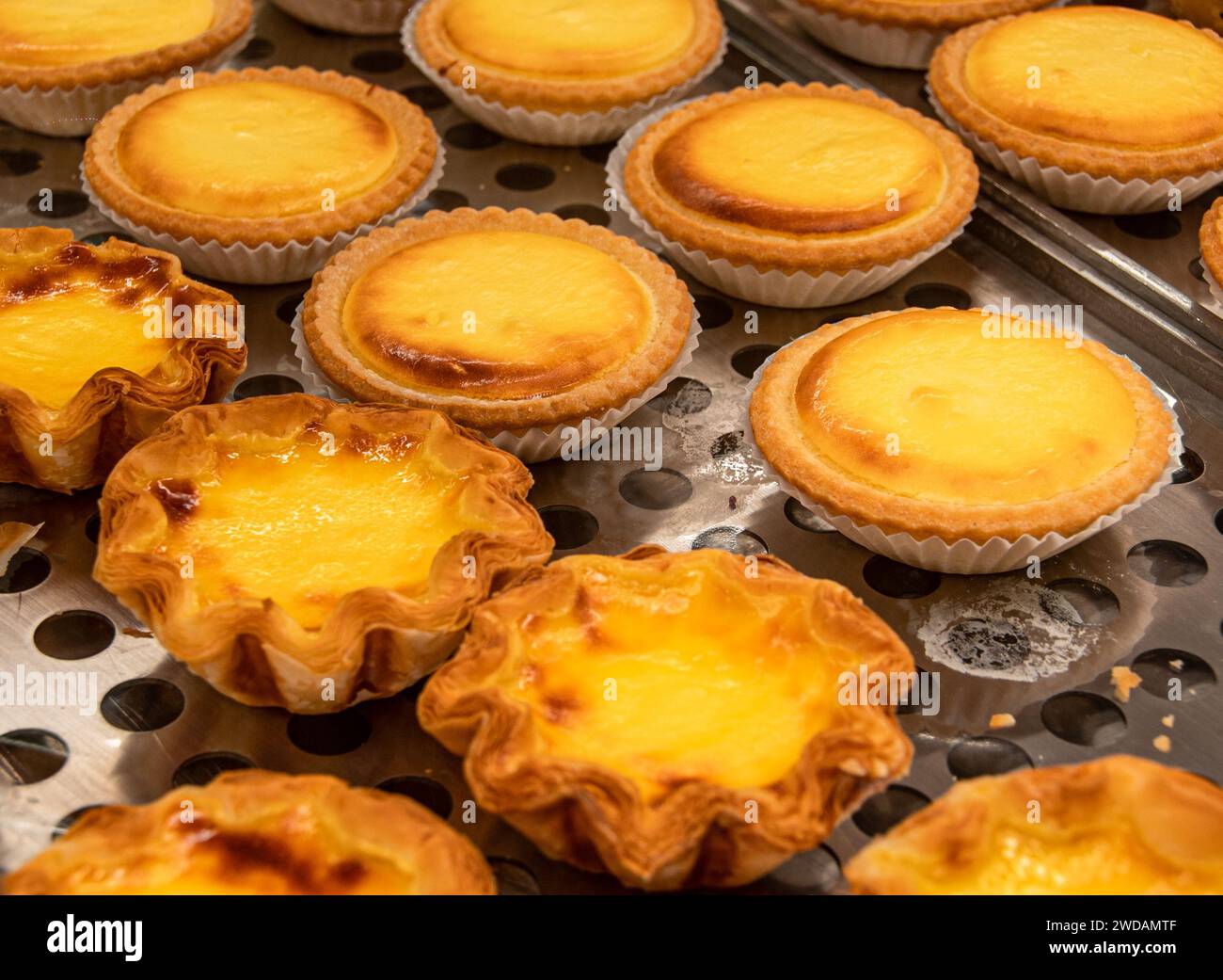 Assortment of petite pastries artfully displayed on a serving tray ...
