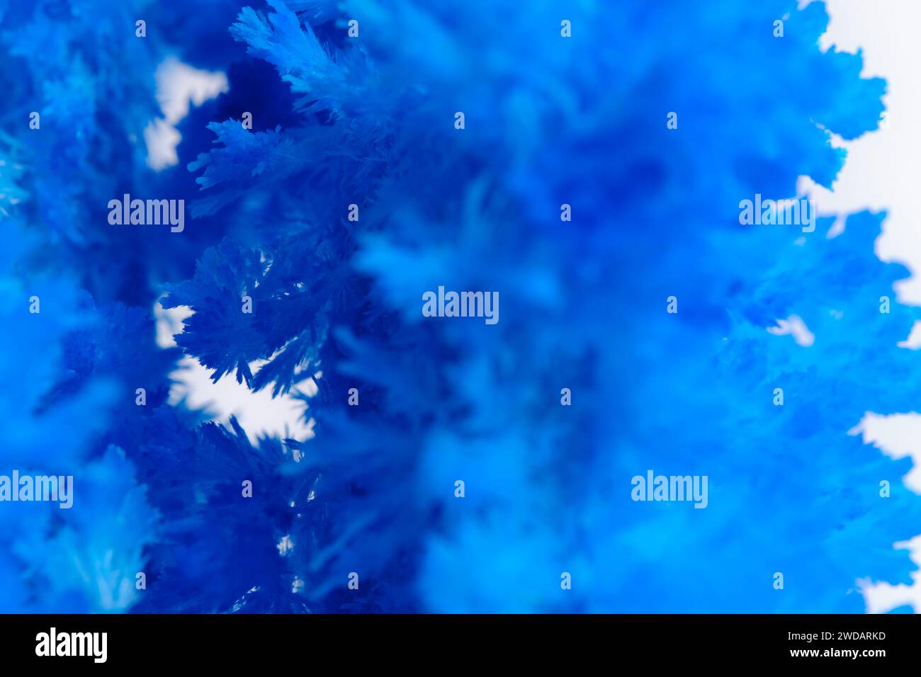 Macro image blue salt crystal on white background Stock Photo - Alamy