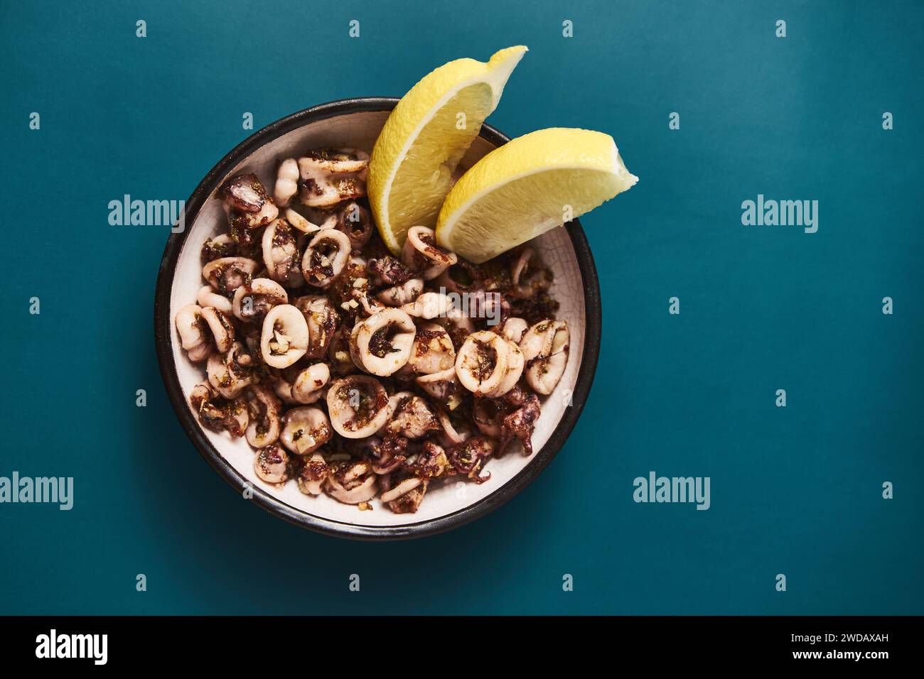 Sauteed Calamari. Baby Calamari cooked with oregano, thyme and garlic ...