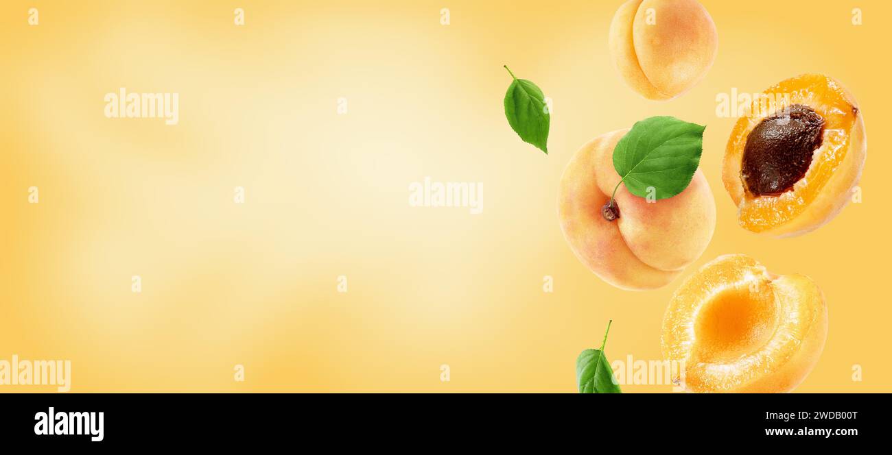 apricots group, slices and leaves flying on apricot colour background ...