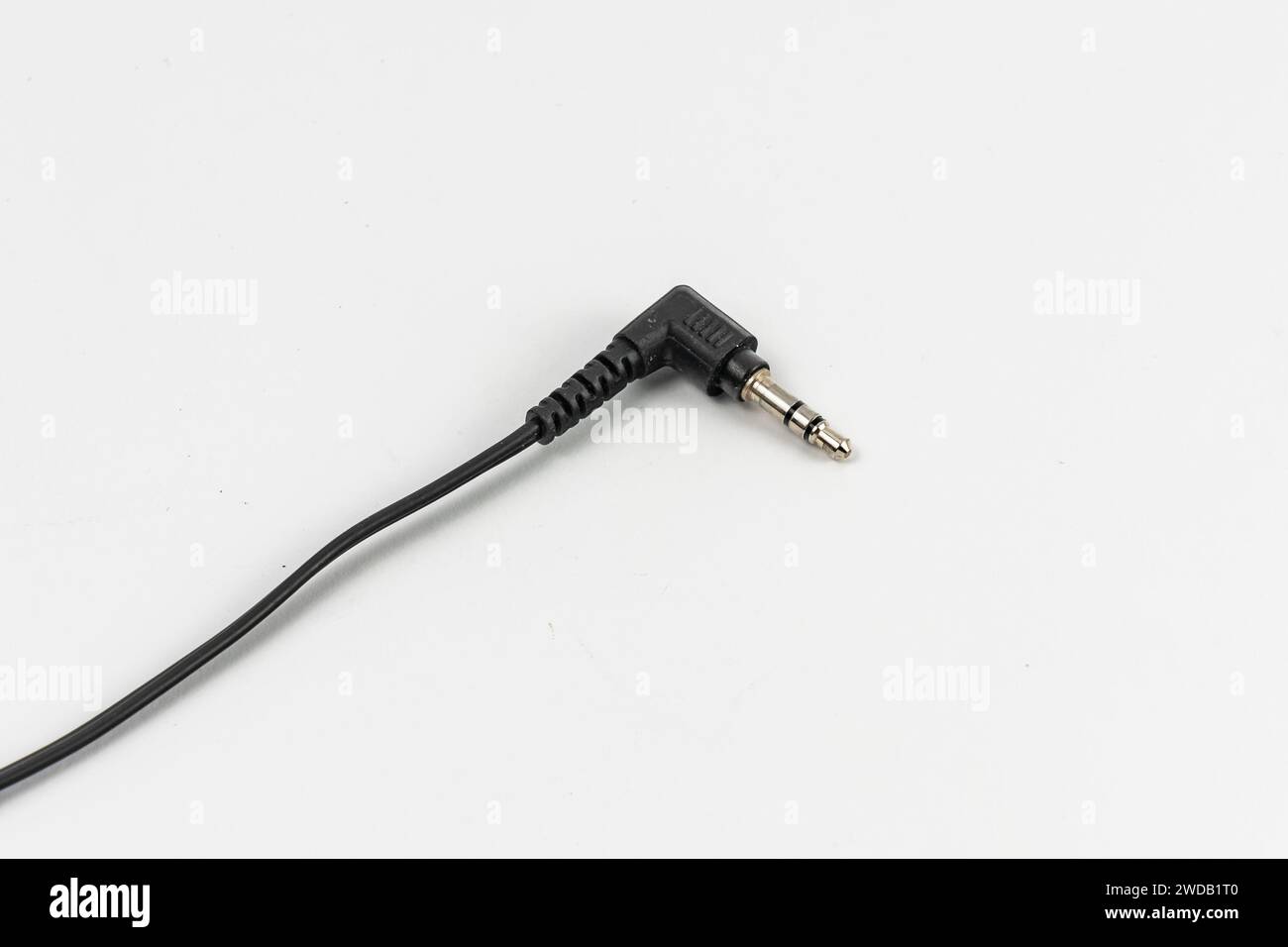 Long black cable of headphones with microjack connector at the end ...