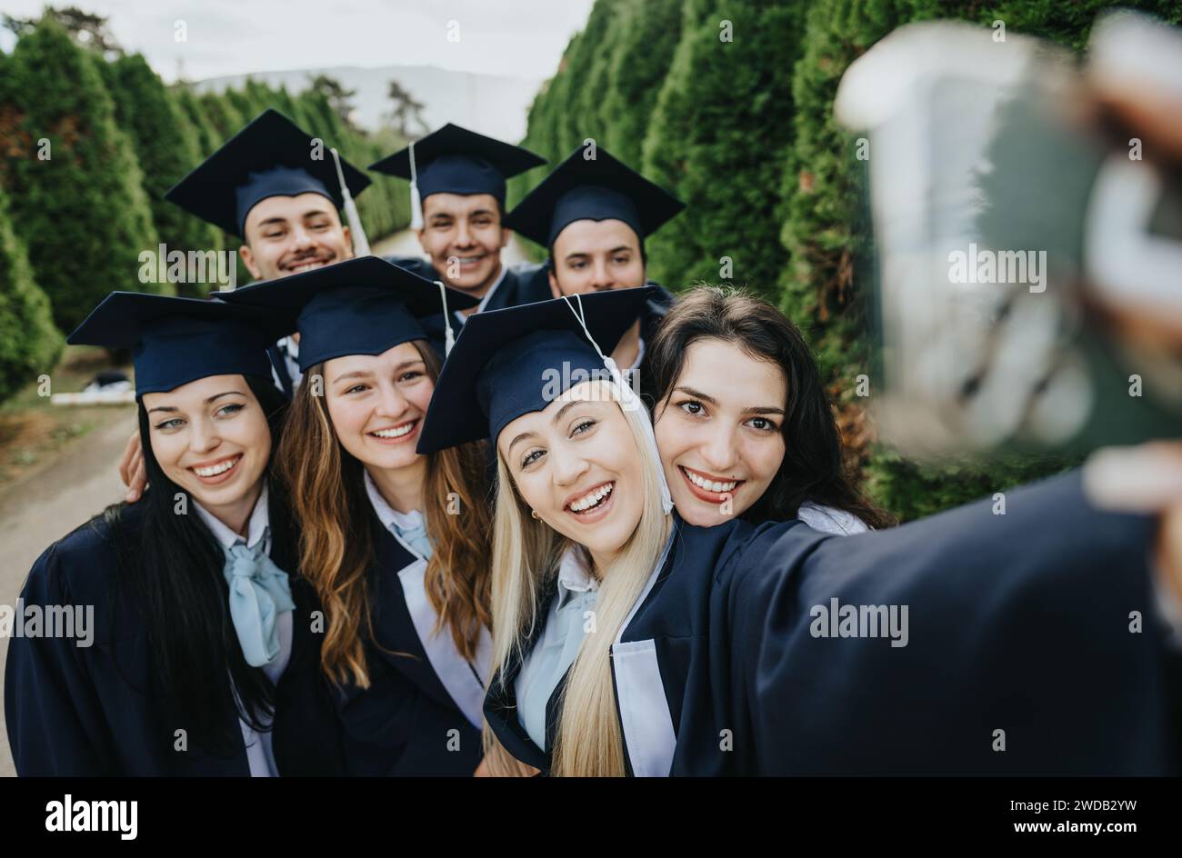 Celebrating Graduation in Park. Happy Students Taking Selfie in ...