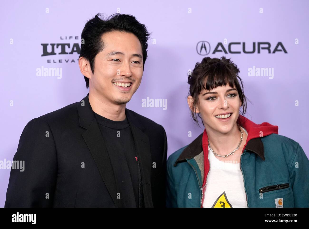 Steven Yeun, left, and Kristen Stewart, cast members in "Love Me," pose ...