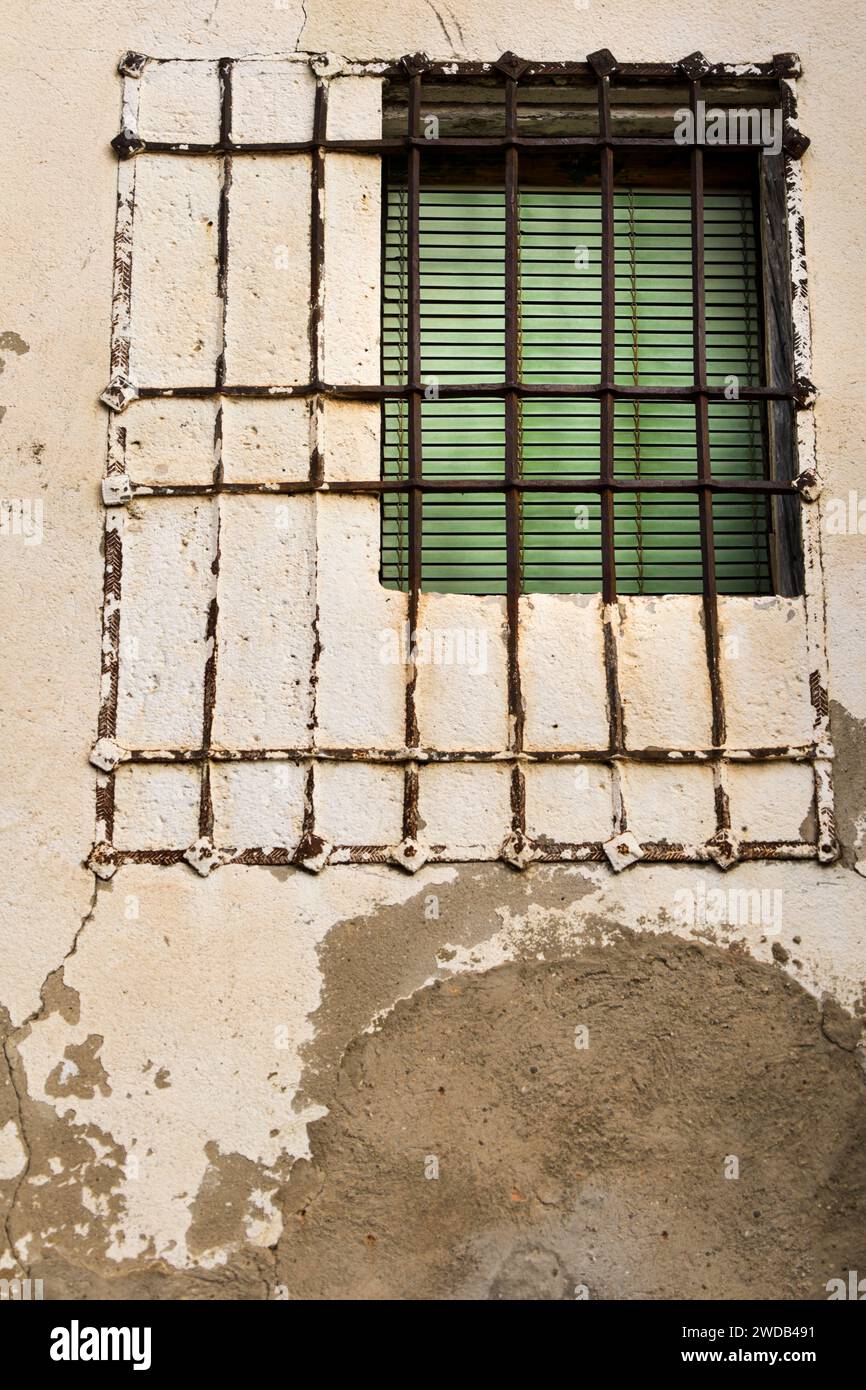 Window with iron grill on chipped facade Stock Photo - Alamy