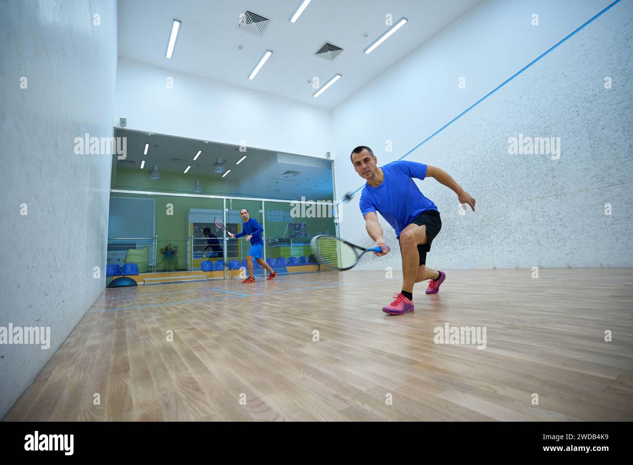 Athletic men challenging each other in squash enjoying the game Stock ...