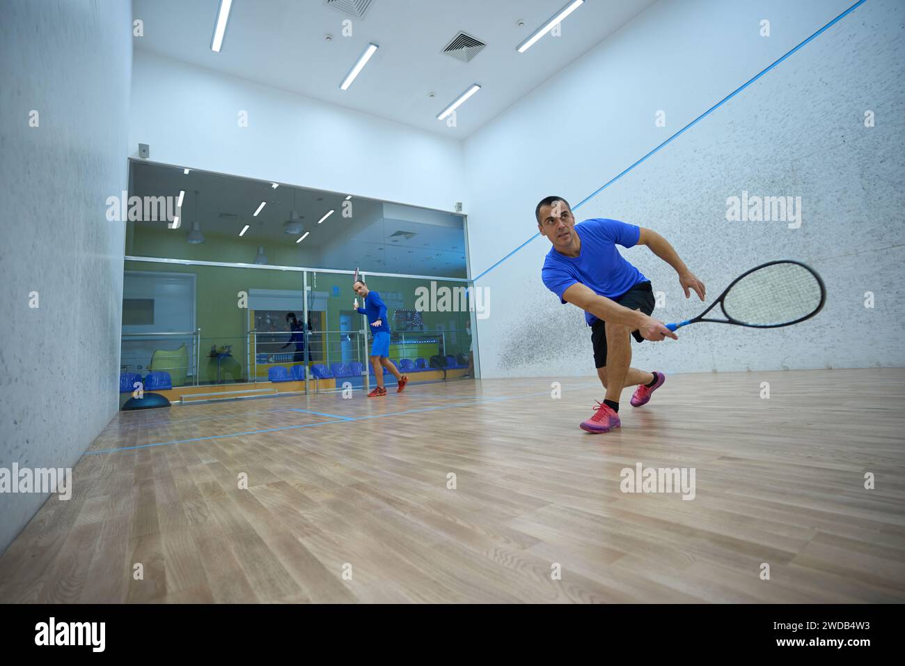 Active men working out engaging in friendly squash matches Stock Photo ...