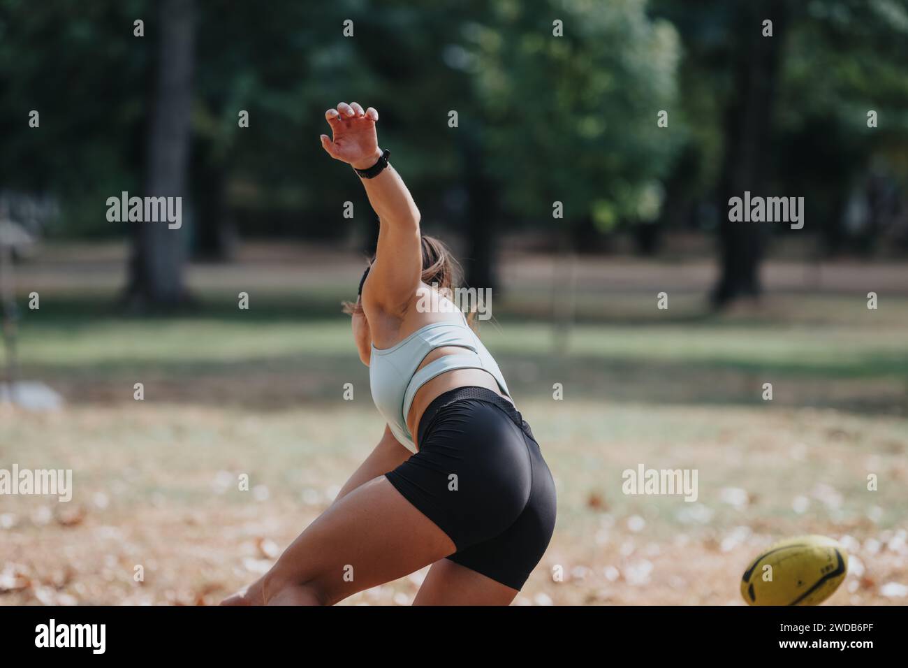 Sports girl falling after she missed to catch the ball. Falling concept ...