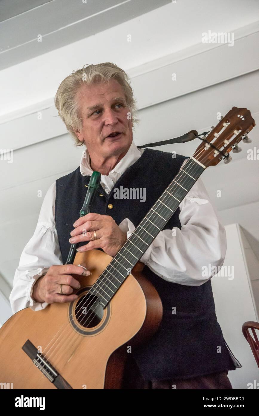 Folk singer with guitar performs inWilliamsburg, VA tavern Stock Photo ...