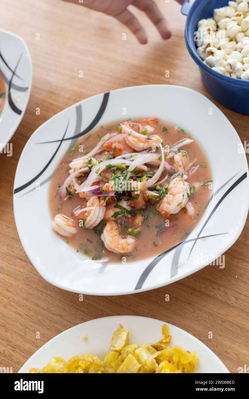 restaurant table, plate with shrimp ceviche, traditional food from ...