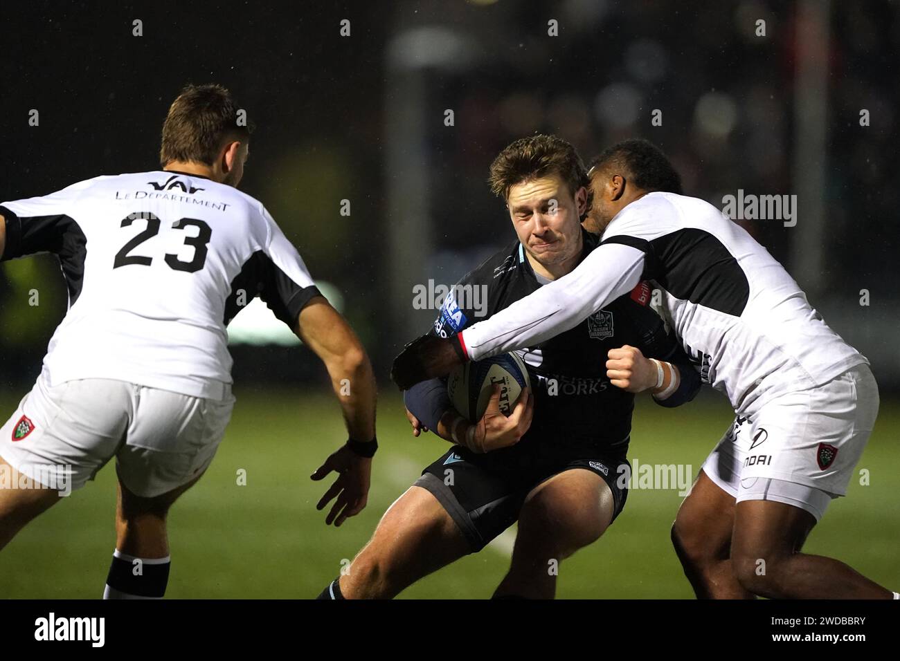 Glasgow Warriors' Kyle Rowe (centre) is tackled during the Investec ...