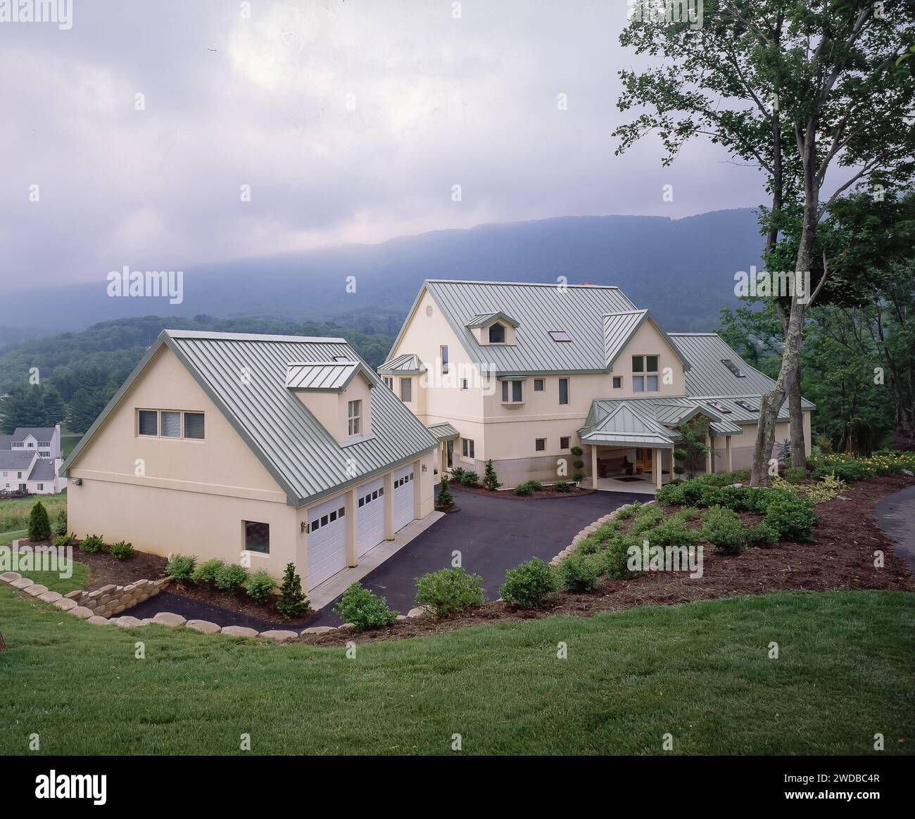 Personal residence house with metal roof Stock Photo - Alamy