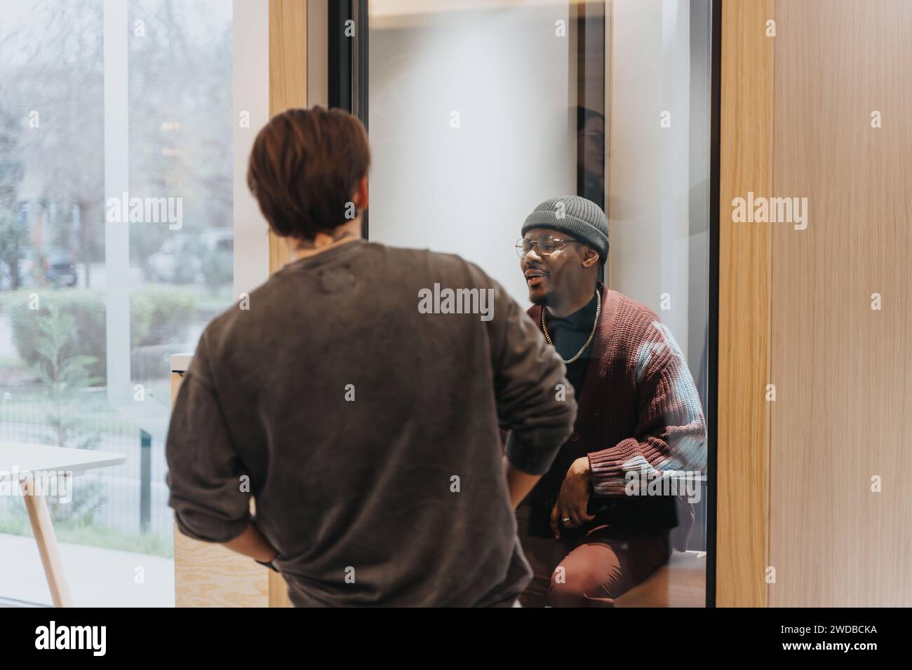 Conversation between two colleagues hi-res stock photography and images ...