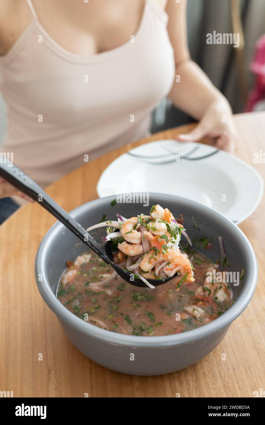 preparation of healthy soup, food with seafood and vegetables ...