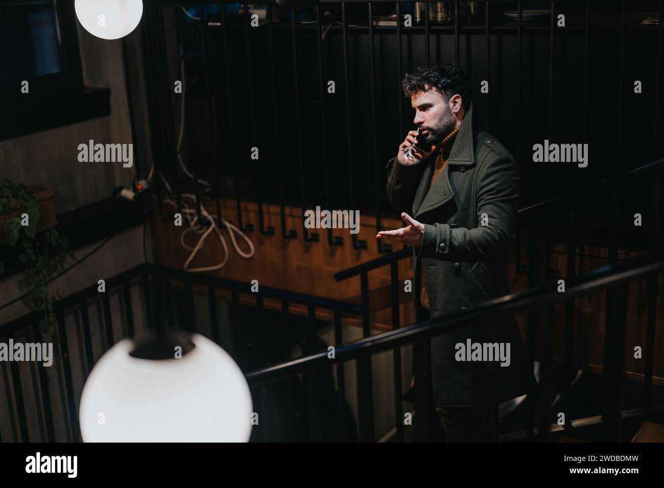 Persistent businessman negotiates with a client during a late-night ...