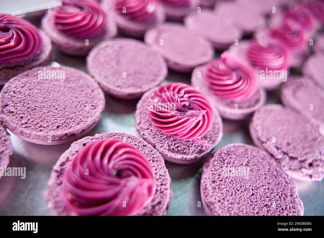 Batch of mouth-watering biscuits arranged on baking tray on worktop ...