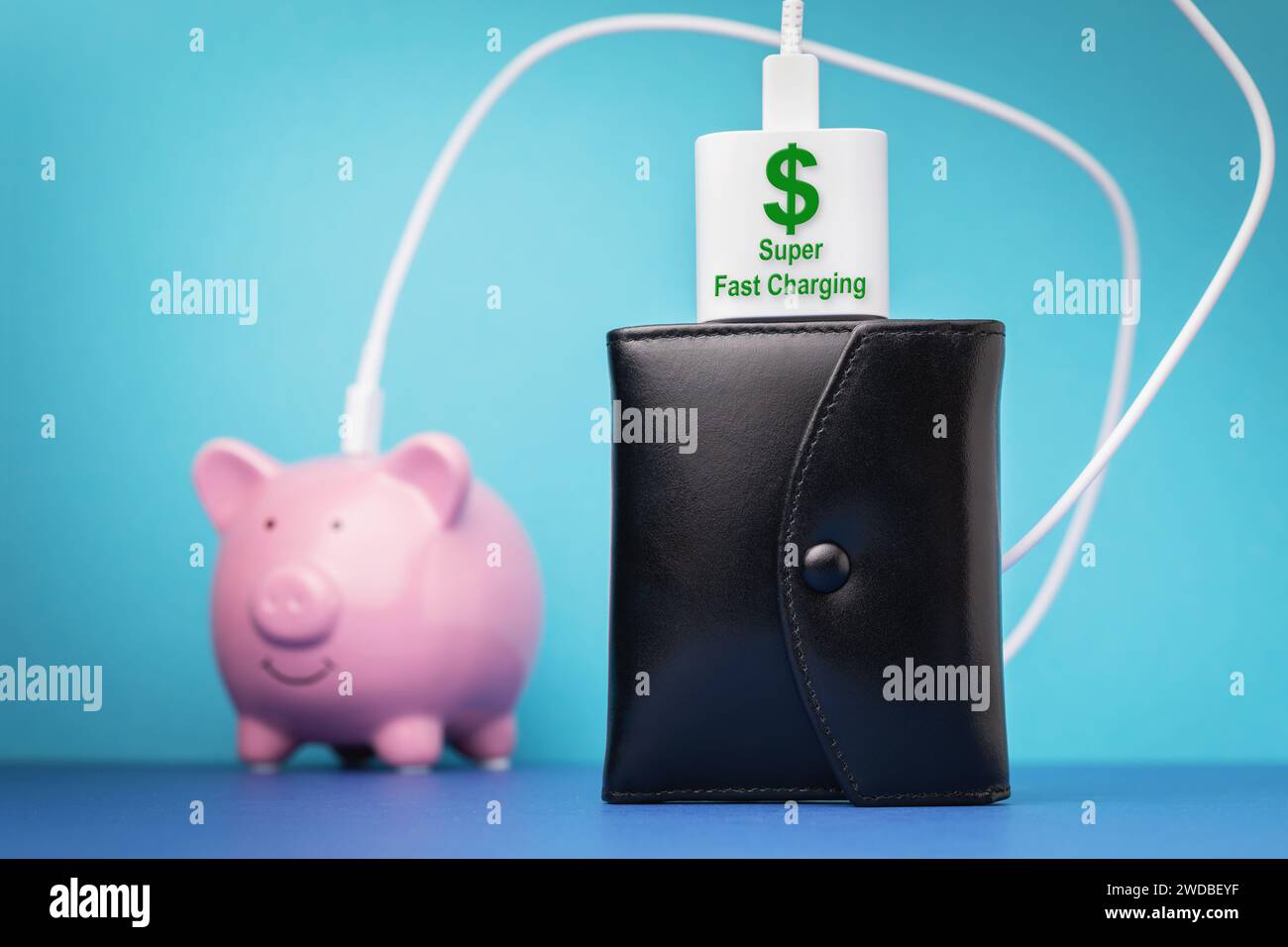 Piggy bank, wallet and smartphone charger with dollar symbol on a ...