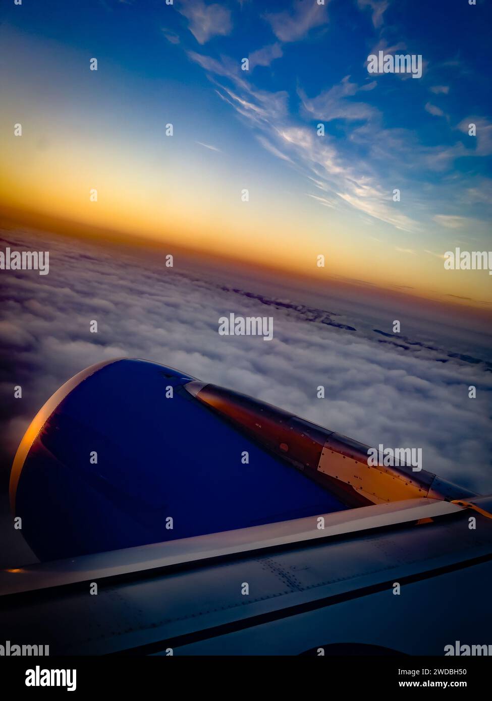 view out airline window of wing, jet engine above the clouds Stock ...