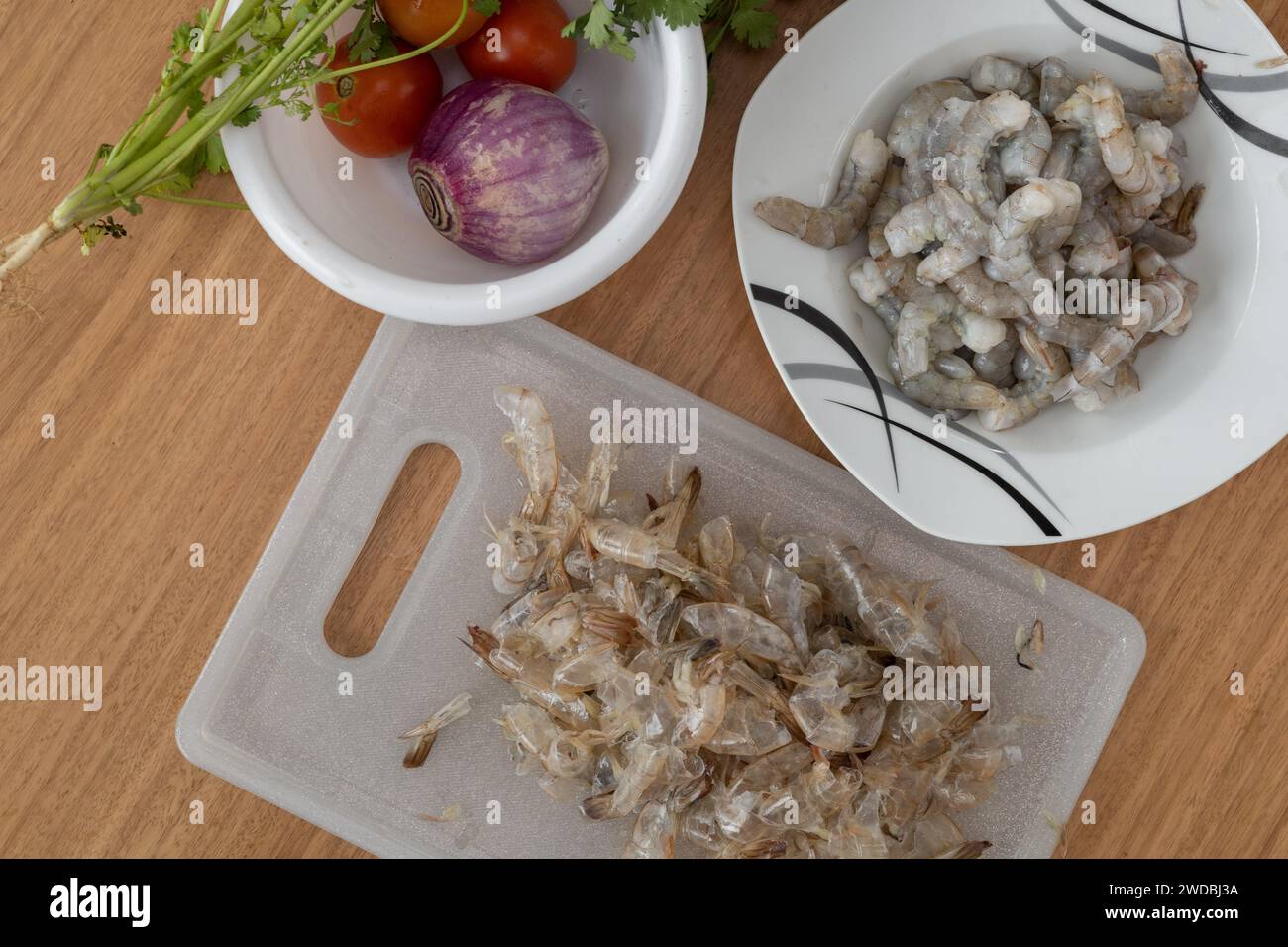 healthy food ingredient, detail of peeled shrimp, shells, vegetables ...