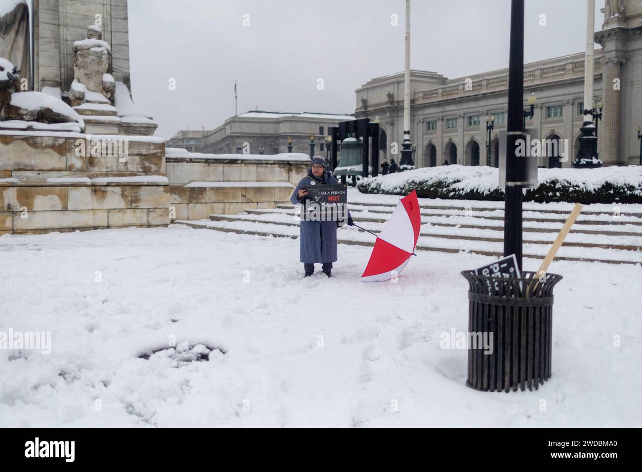 Washington, District Of Columbia, USA. 19th Jan, 2024. A woman stands ...
