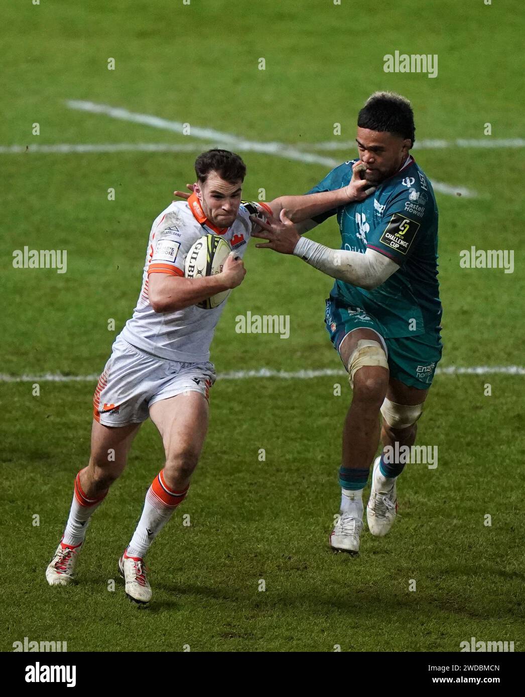 Edinburgh's Matthew Currie holds off Scarlets' Vaea Fifita during the ...