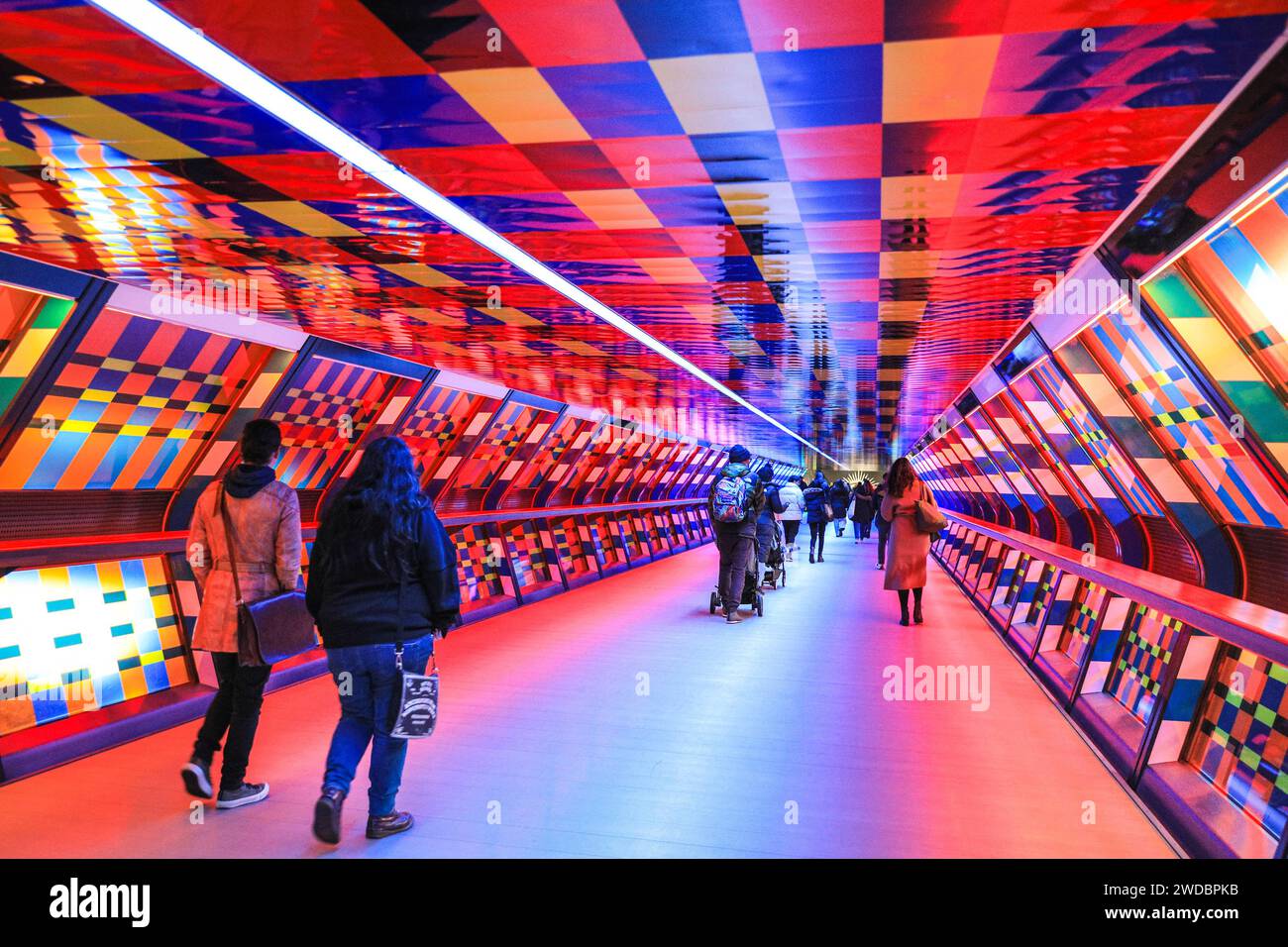 London, UK. 19th Jan, 2024. People walk along, look at and take ...