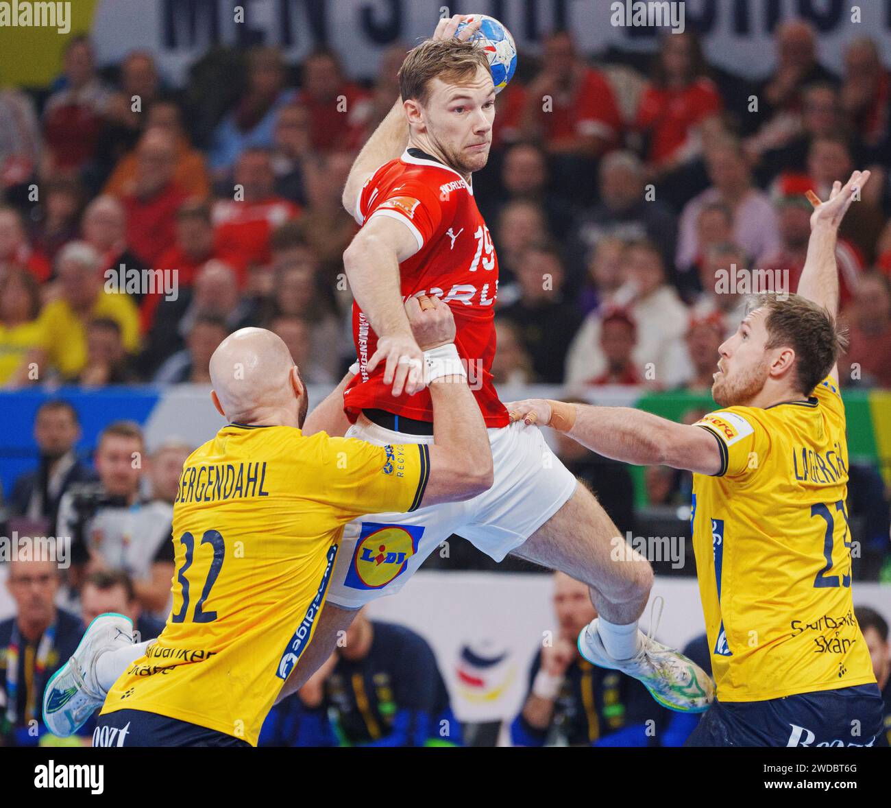 Mathias Gidsel, Denmark (19) in action with Sweden's Oscar Bergendahl (32) and Albin Lagergren ...