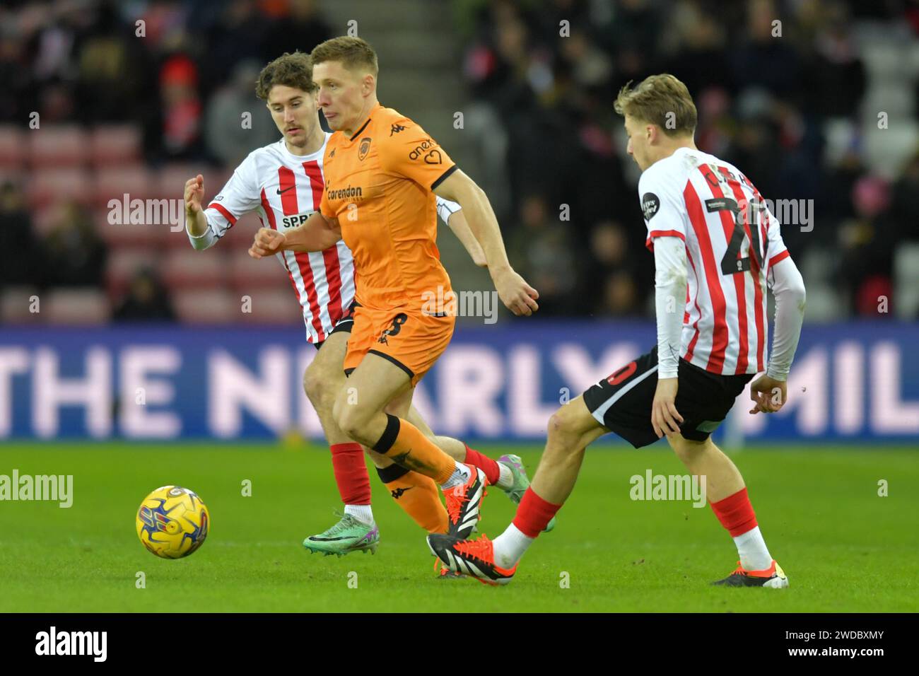 Hull City's Greg Docherty come under pressure from Sunderland's Trai ...