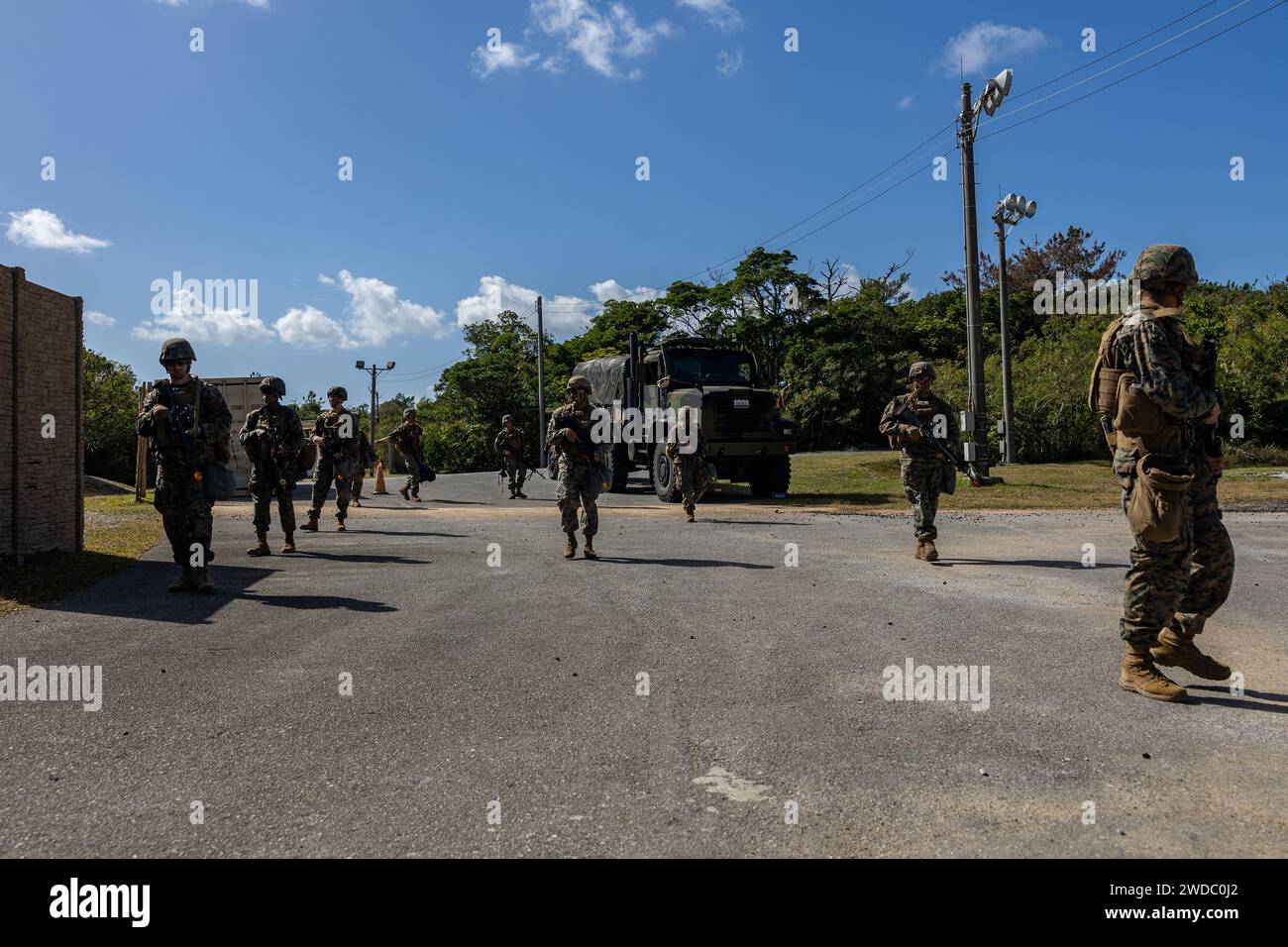 U.S. Marines with Marine Wing Headquarters Squadron (MWHS) 1 patrol ...