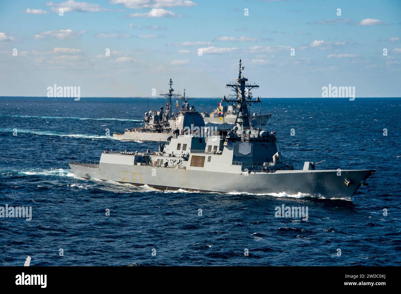 240116-N-TD381-1030 AT SEA (Jan. 16, 2024) From front to back, the ...