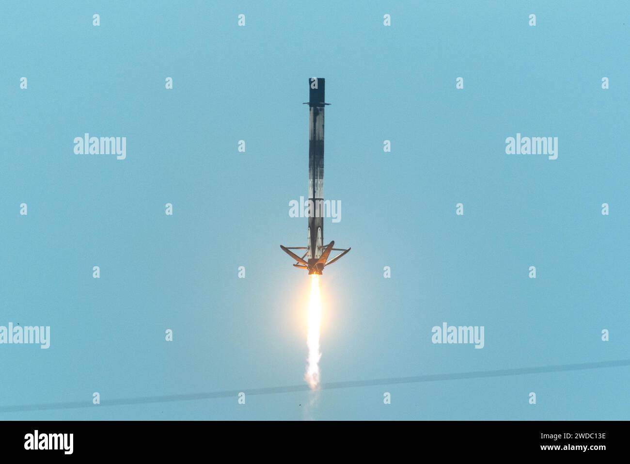 A Falcon 9 booster lands at Landing Zone 1 (LZ-1) at Cape Canaveral ...