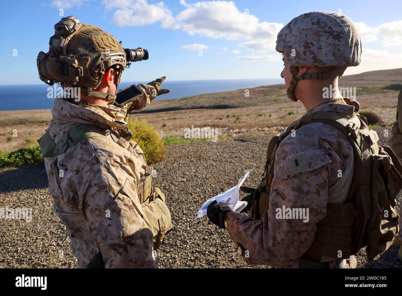 A U.S. Marine with Reconnaissance Company, left, and 1st Lt. David Molz ...