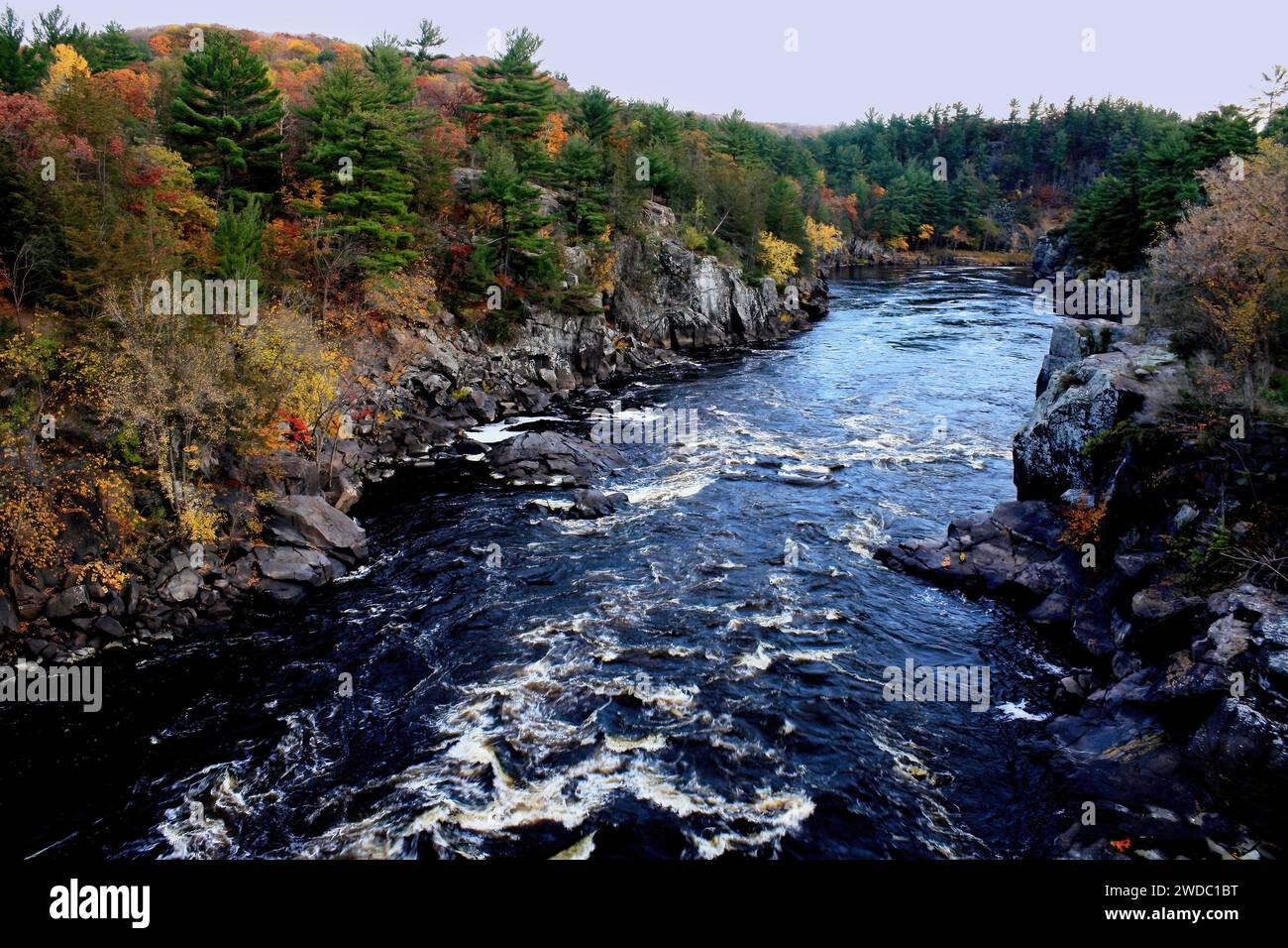 Beautiful fall scene of the St. Croix River flowing through Interstate Park on a cold October ...