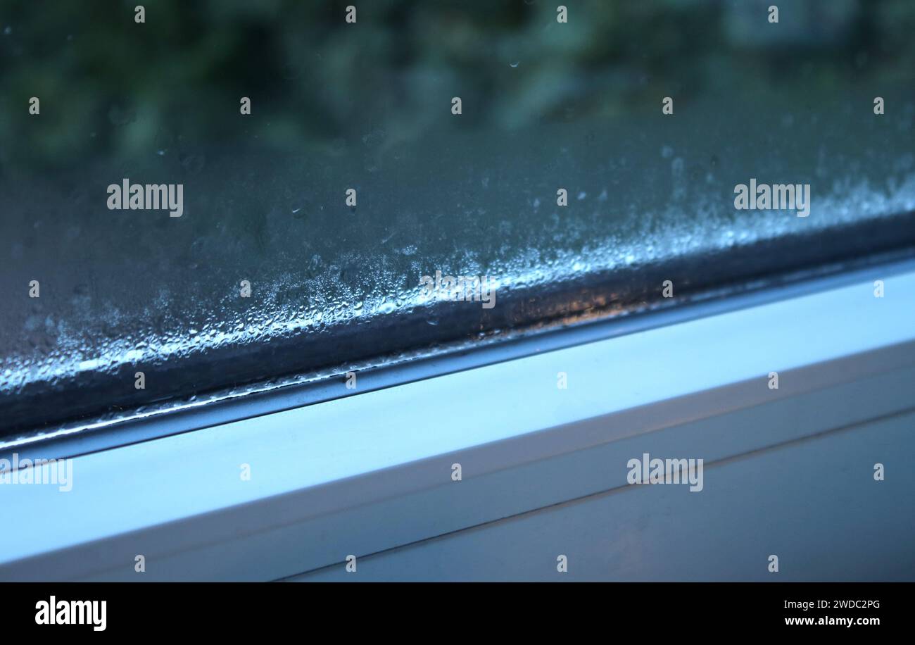 Close up of condensation on the window in a house, water drops and ...