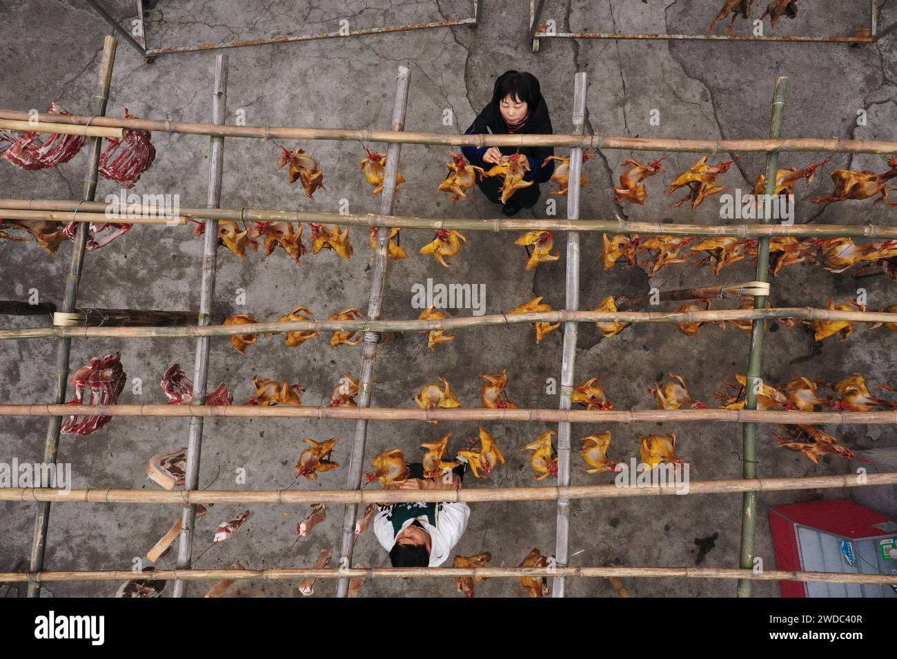 MEISHAN, CHINA - JANUARY 19, 2024 - People air dry their own cured ...