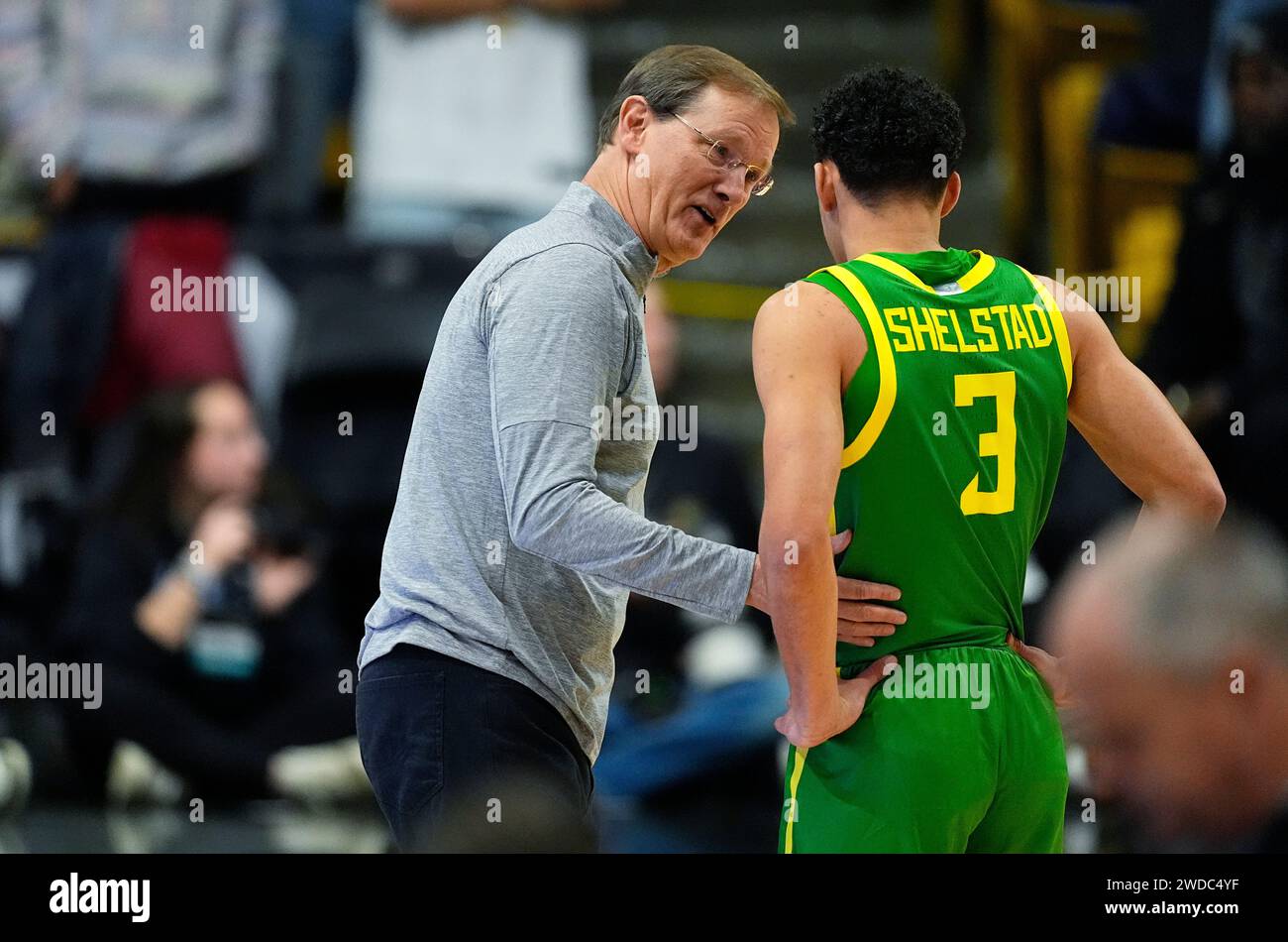 Oregon head coach Dana Altman confers with guard Jackson Shelstad in ...