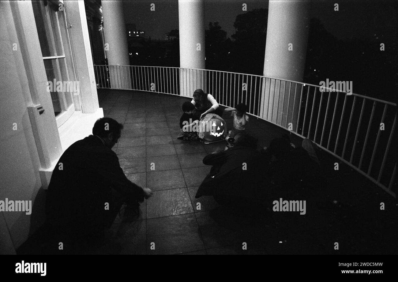 Photograph of Susan Ford and Unidentified Children Carving a Halloween ...