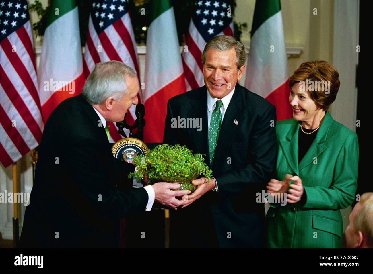 President George W. Bush and Laura Bush receive a bowl of Shamrock from ...
