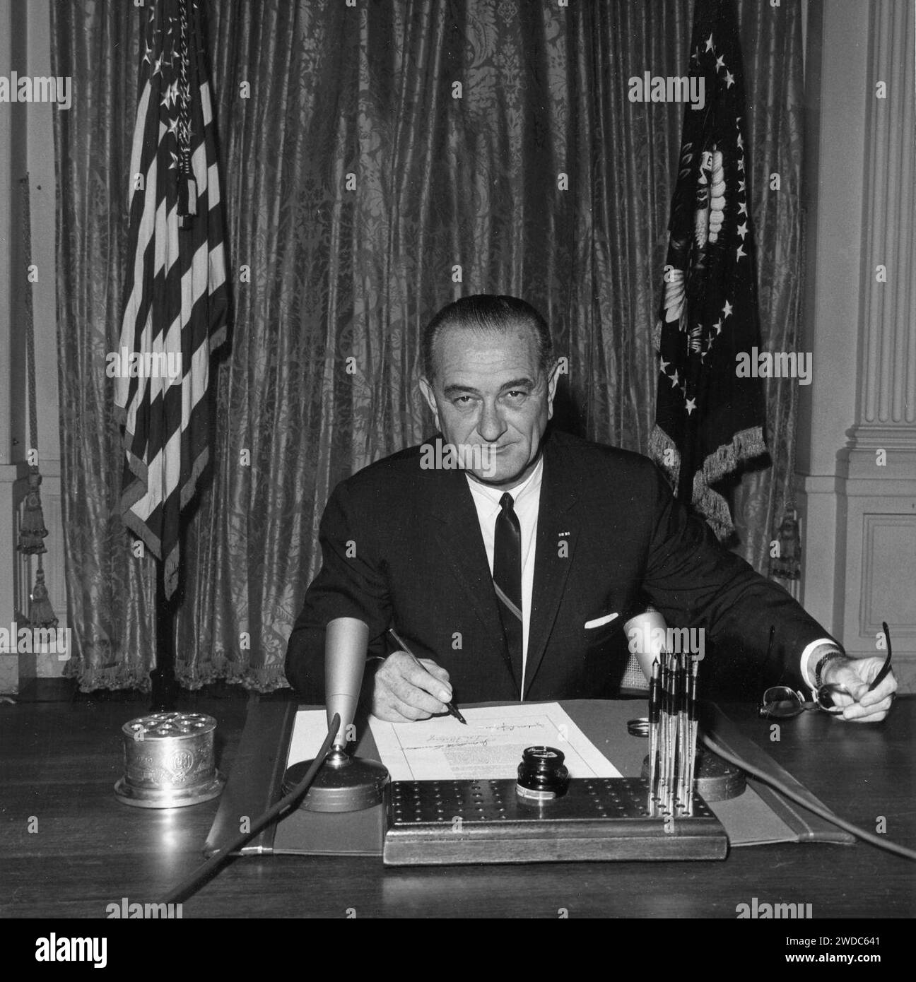 President Lyndon B. Johnson signs Gulf of Tonkin resolution Stock Photo ...