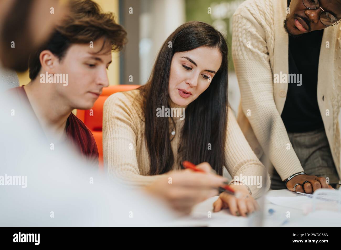 Multiracial team collaborating and brainstorming marketing strategy ...