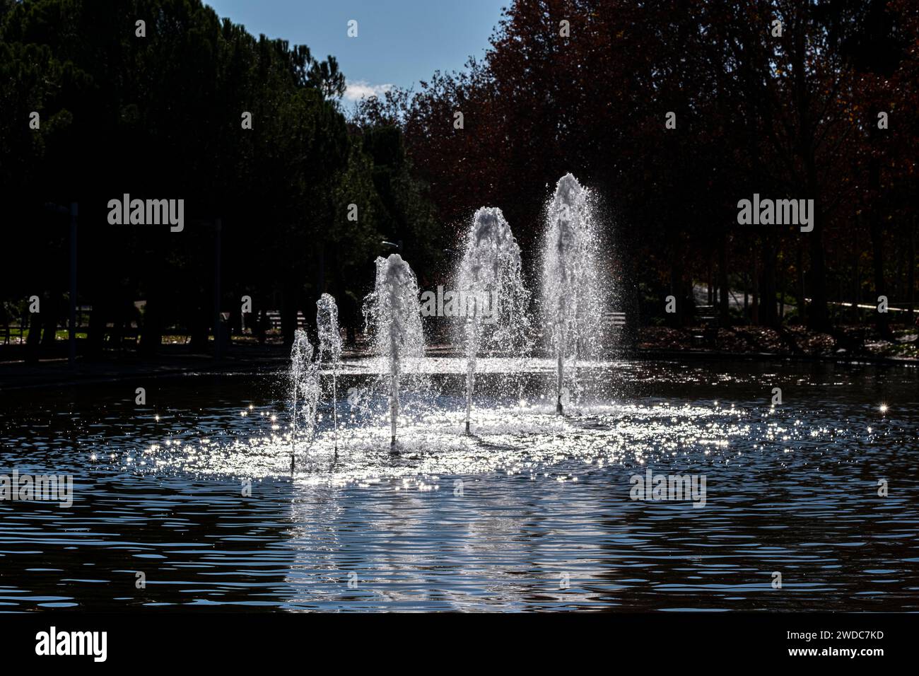 Fountain in a roundabout in a park Stock Photo - Alamy