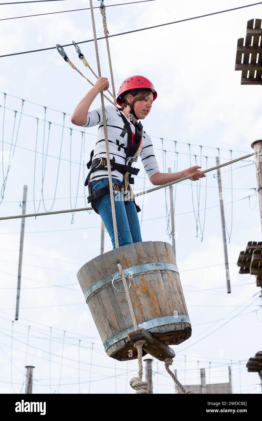 Young girl in climbing park, climbing, action, safety, belay, belay ...