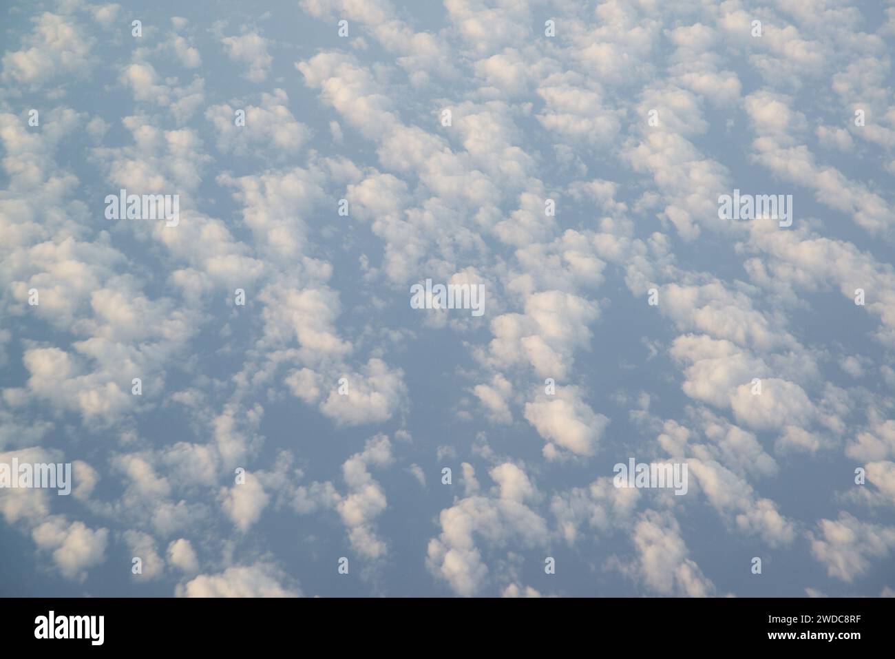 Nature background of sky view with clounds from above from airplane ...
