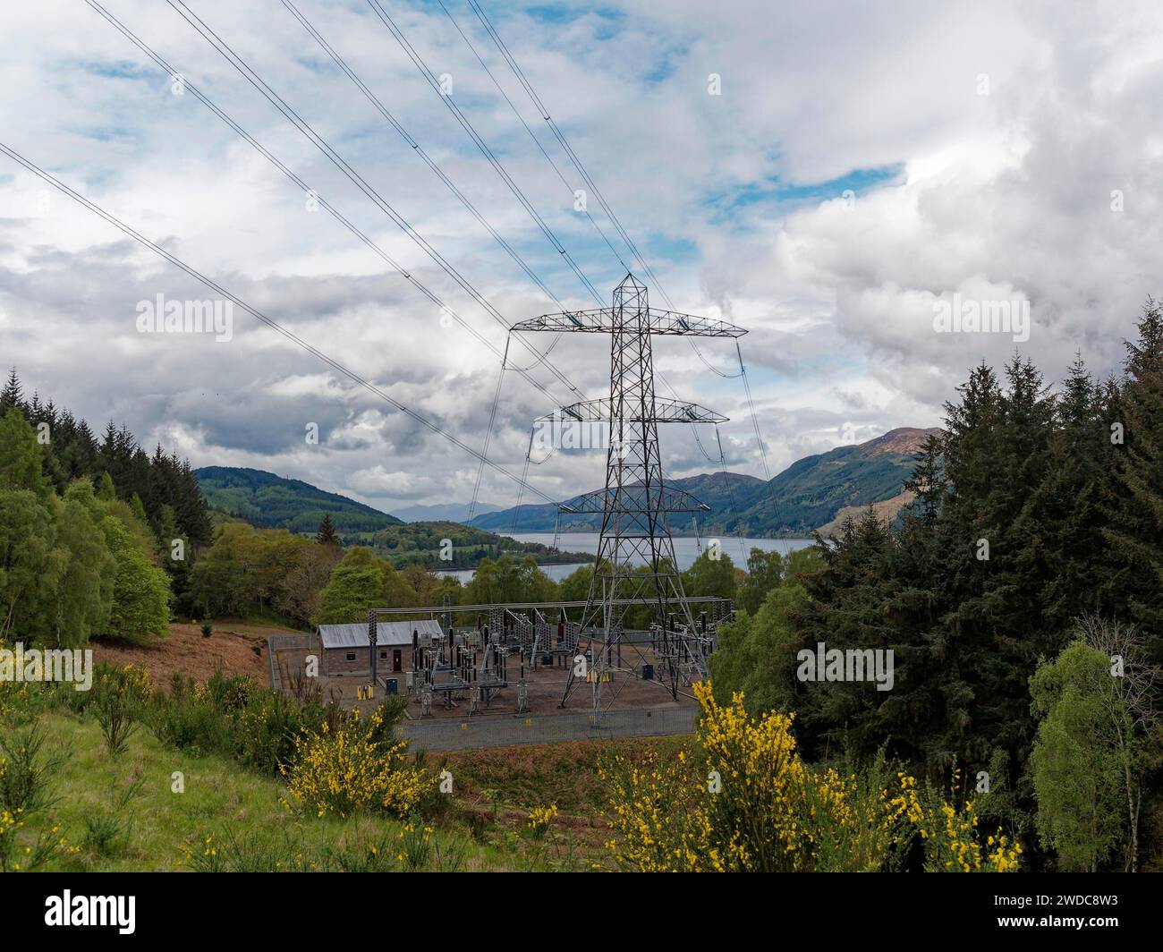A power station in the middle of a natural landscape with electricity ...
