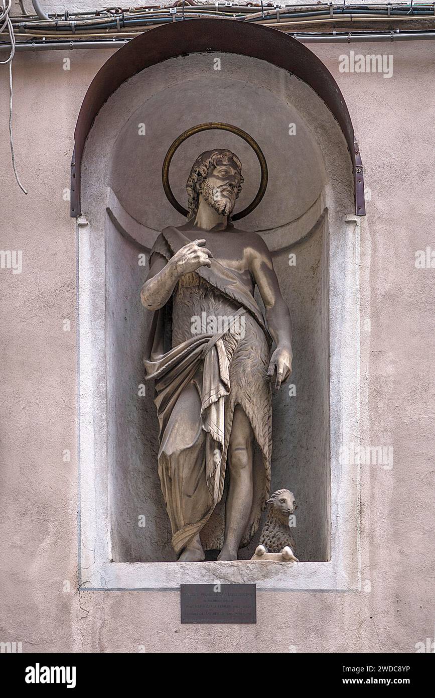 Sculpture of Juesu with the lamb, in a niche on the facade of a ...